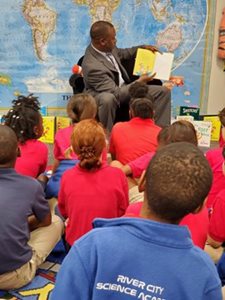 Jacksonville.gov - Reading to 2nd Grade Class at River City Science Academy